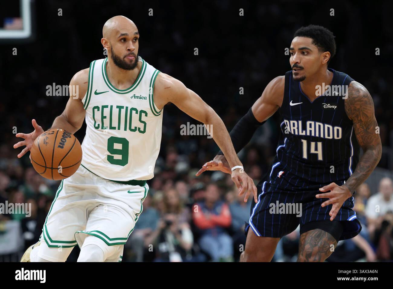 Boston Celtics' Derrick White (9) drives past Orlando Magic's Gary ...