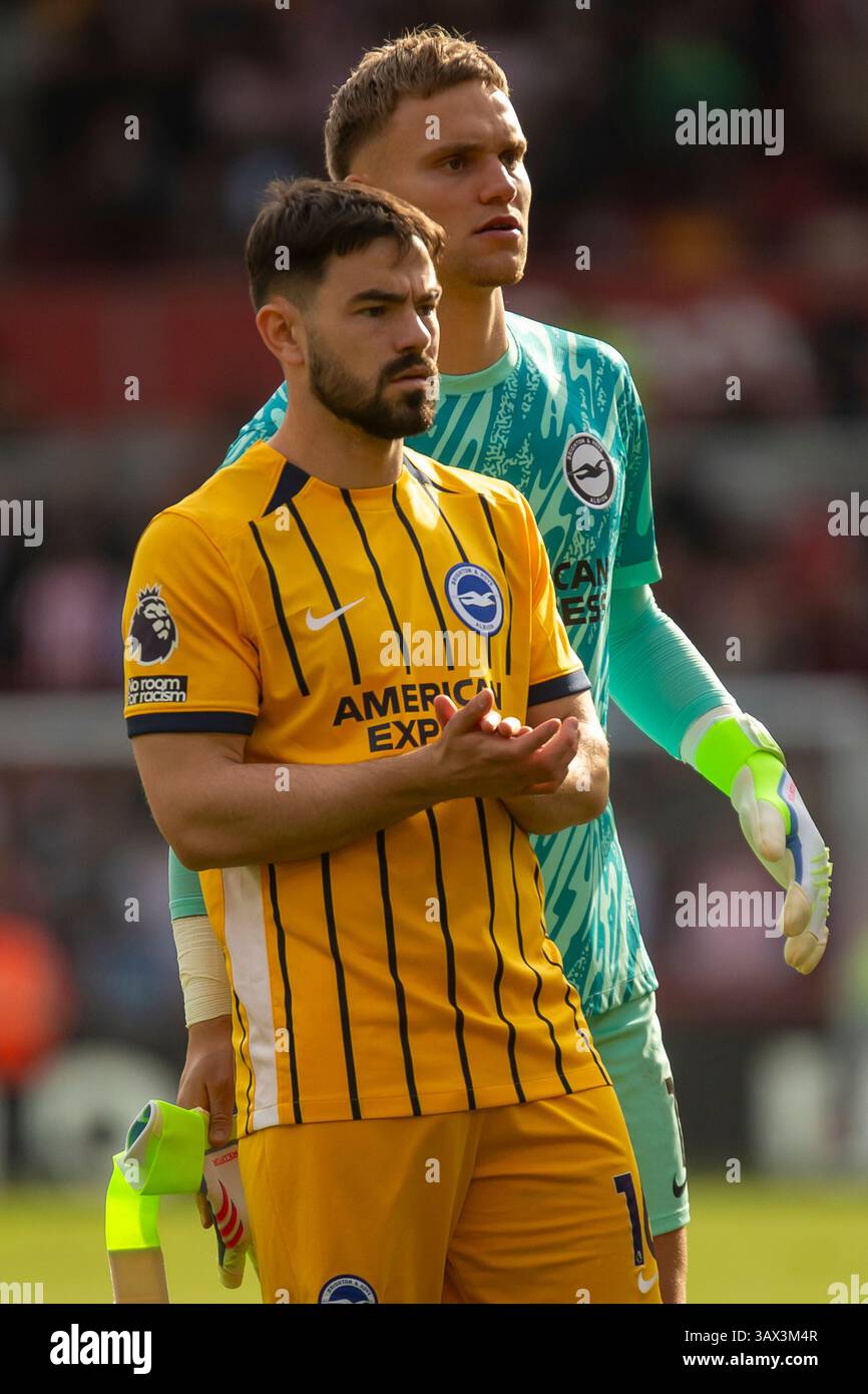 Eiran Cashin of Brighton & Hove Albion and Bart Verbruggen applauds the ...