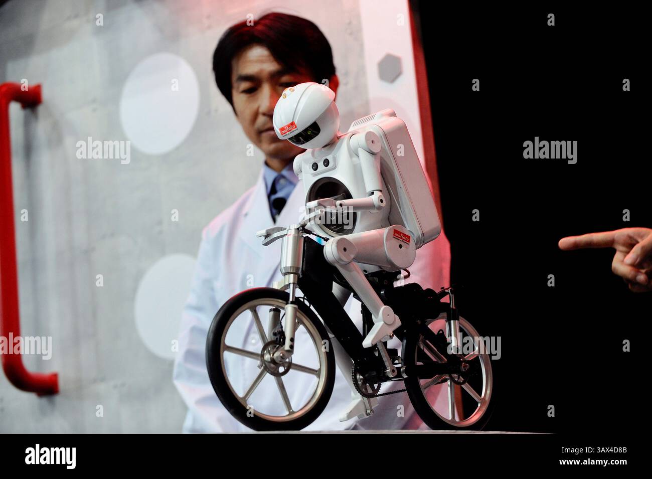Seisaku-kun, a cycling humanoid robot from Murata Manufacturing Co., is ...