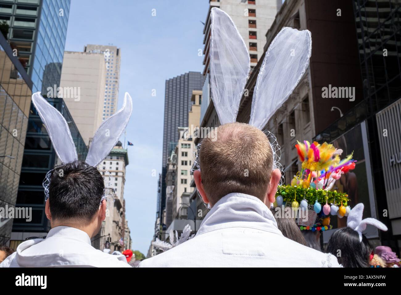 Two men in white rabbit ears, shot from behind. New Yorkers don their ...