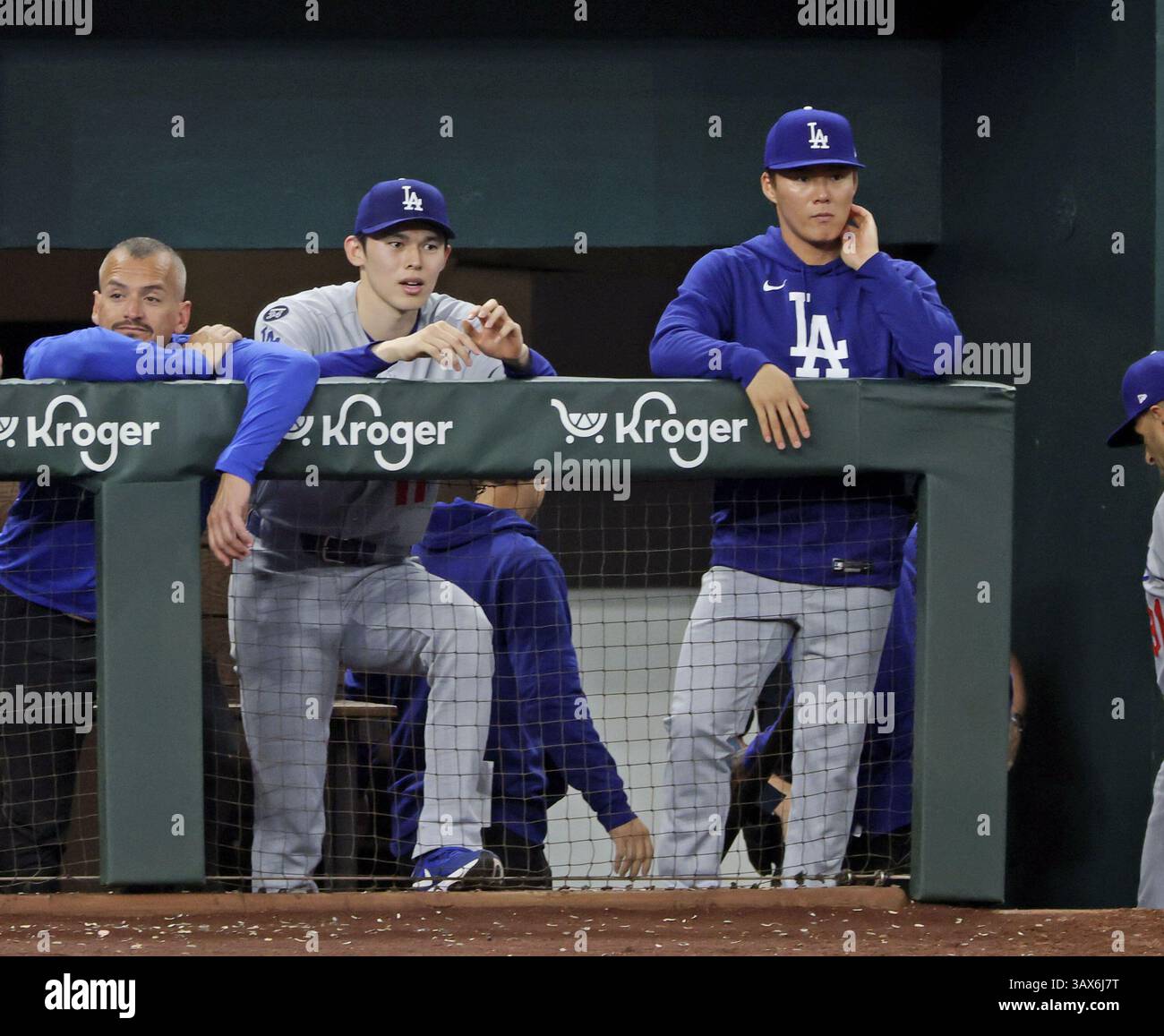 Los Angeles Dodgers starting pitcher Roki Sasaki (C) watches a baseball ...