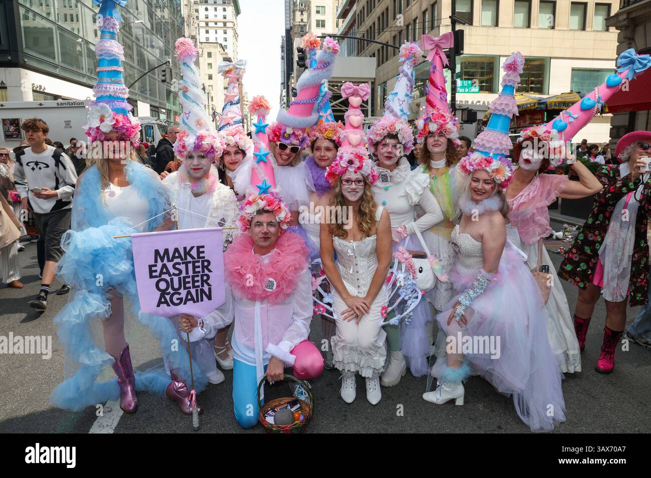 Costumed participants pose for photos during the annual Easter Parade and Bonnet Festival on ...