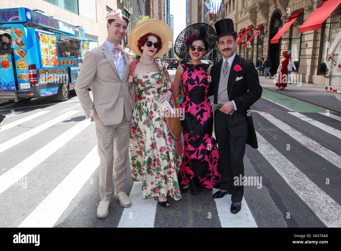 Costumed participants pose for photos during the annual Easter Parade ...