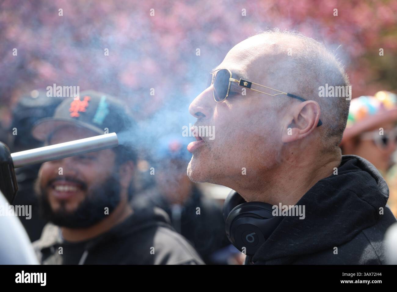 A man gets a shot of marijuana smoke in this face from a Cloud Cannon ...