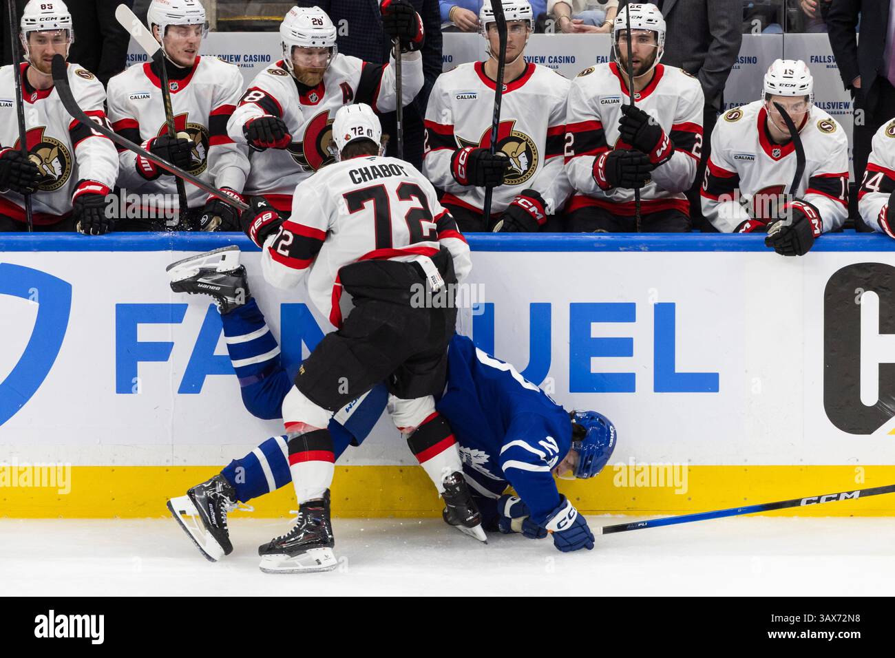 Toronto Maple Leafs‚ Matthew Knies (23) takes a hit from Ottawa ...