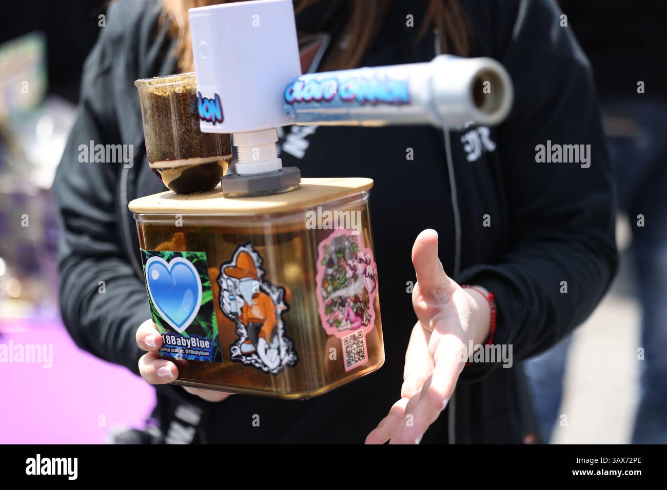 A woman holds a Cloud Cannon at the 420 Celebration on Washington ...