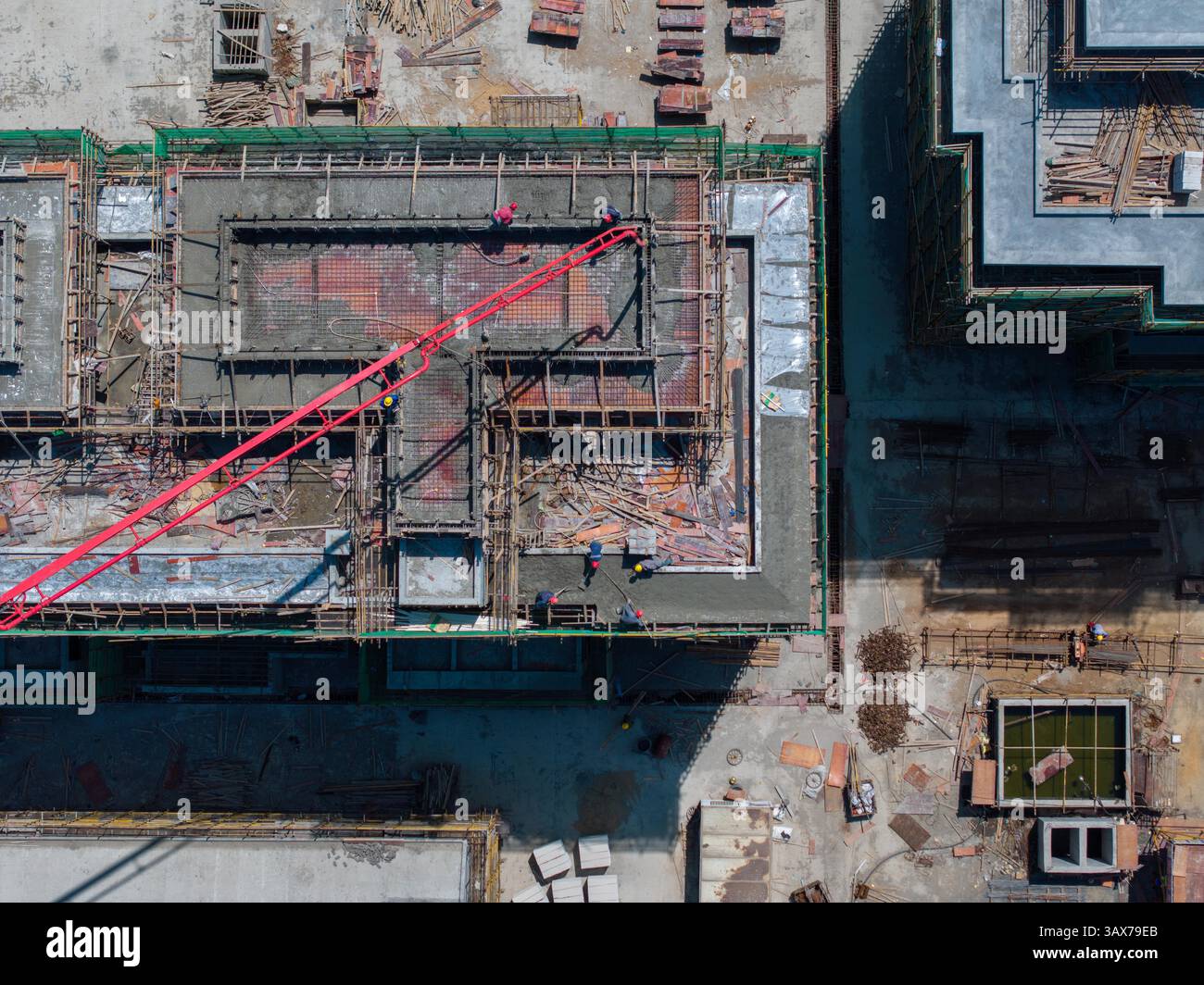 Workers are engaged in construction at the construction site of a new ...