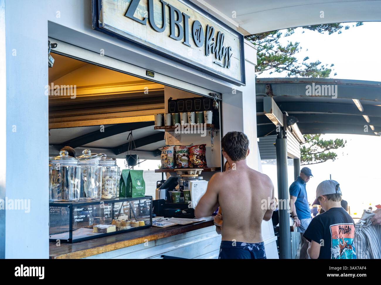 Australian beach cafe coffee shop at Bilgola Beach in Sydney, customers ...