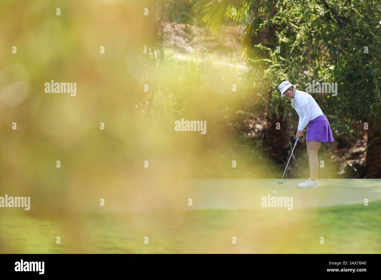 Ingrid Lindblad putts on the fourteenth green during the final round of ...