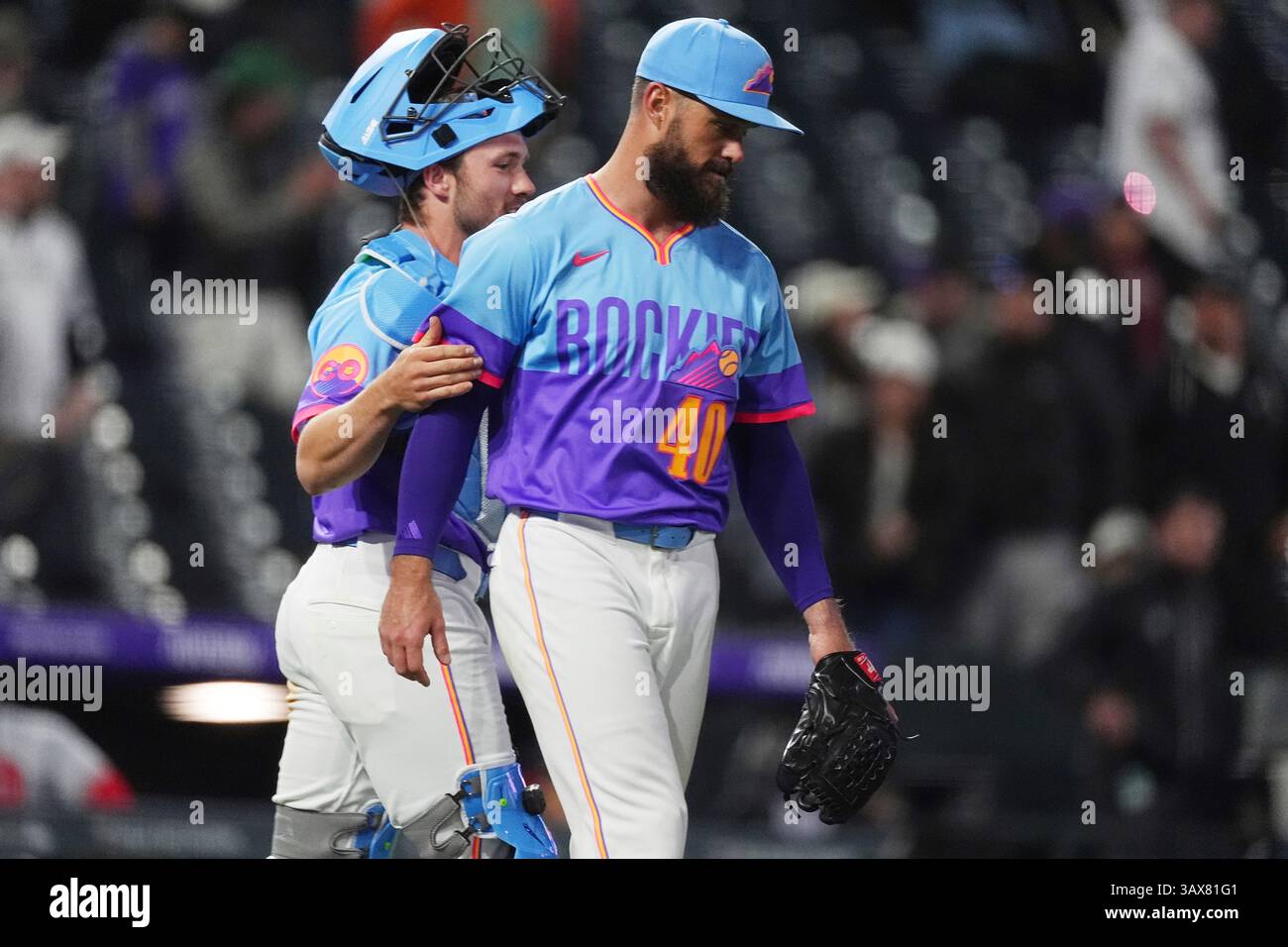 Colorado Rockies relief pitcher Tyler Kinley, front, is congratulated ...