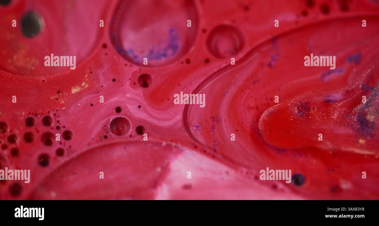 Translucent bubbles. Defocused coloring fluid. Sparkling shining flowing paint motion on ...