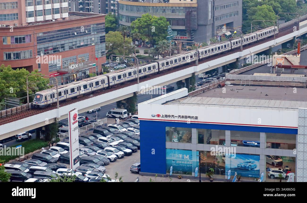 Shanghai Metro Line 3 runs among high-rise buildings in Shanghai, China ...