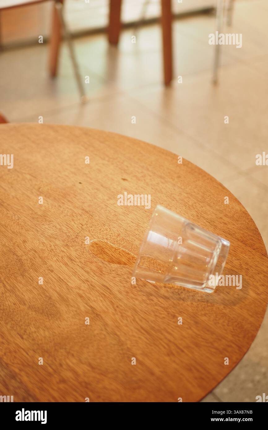 water spilled from a glass on a table Stock Photo - Alamy