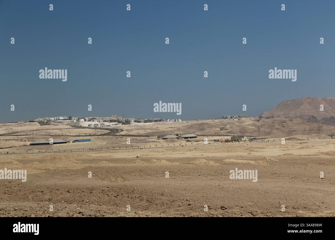 Desert scenery and road sign of Al Galala City on the road trip from ...