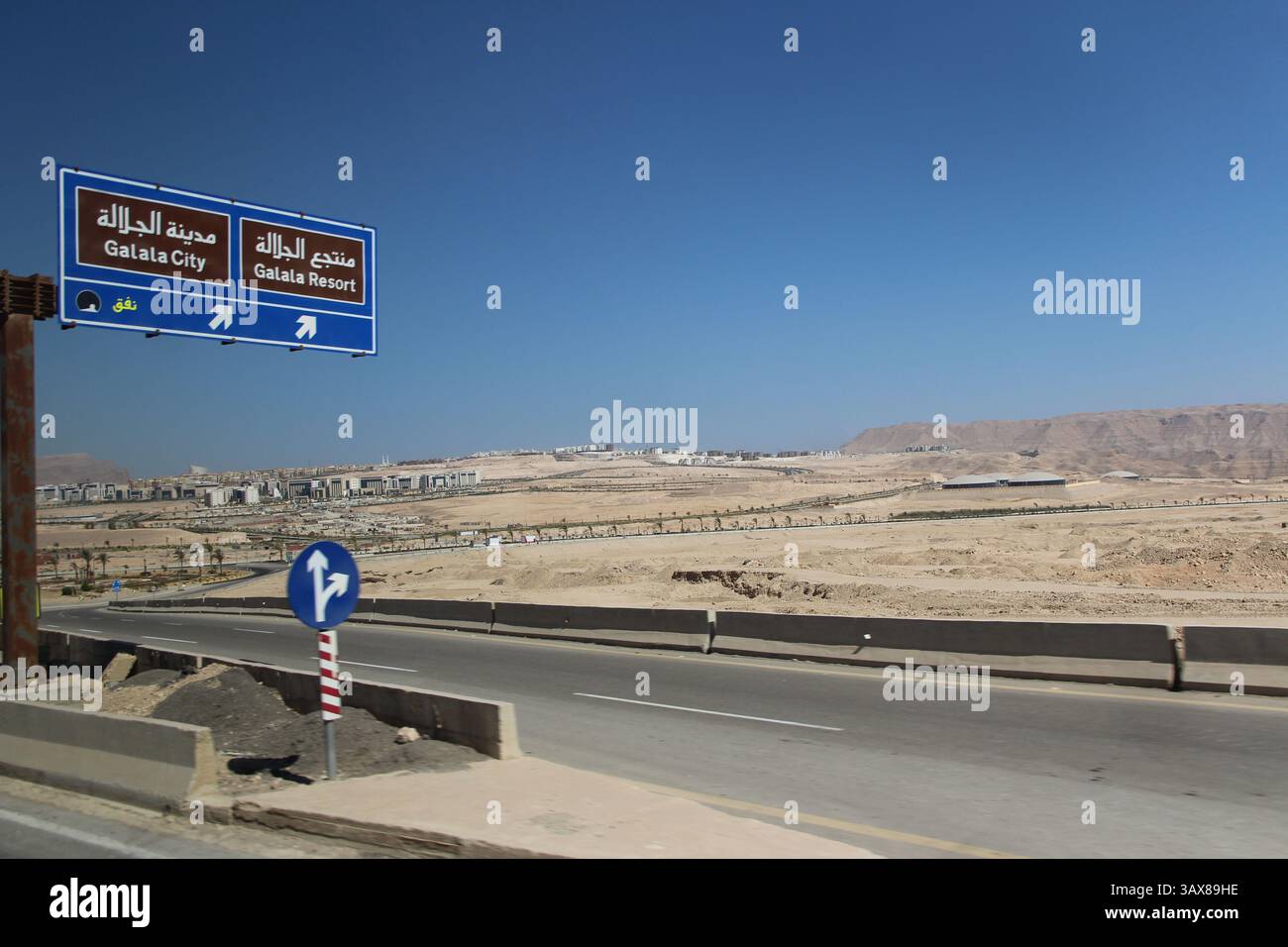 Desert scenery and road sign of Al Galala City on the road trip from ...