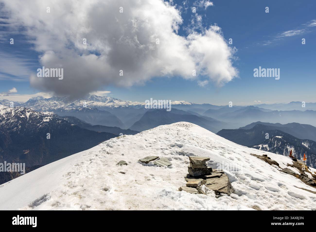 stunning snow-covered mountain summit with layered peaks under clear ...