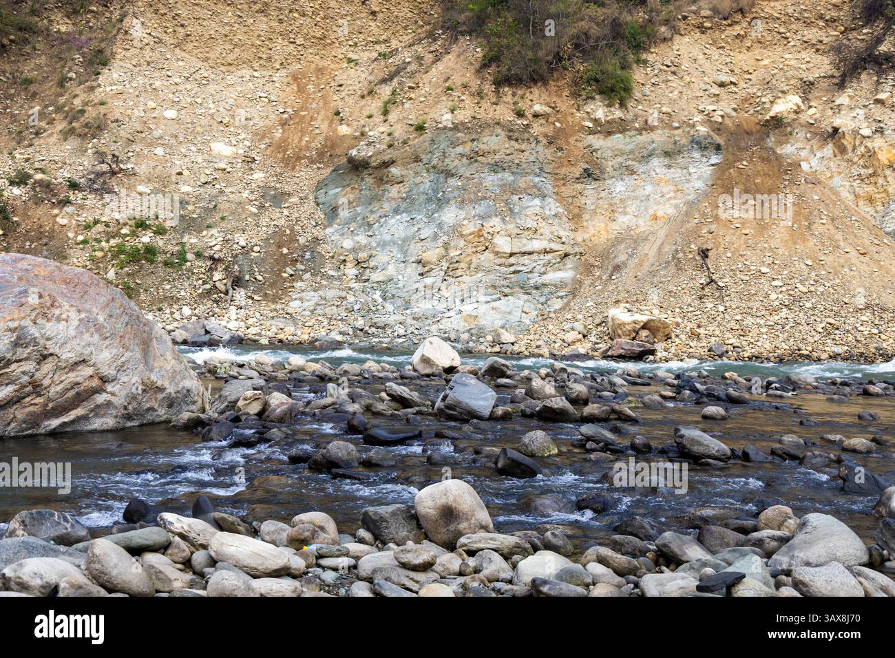 mountainous rocky river bed with small stream from flat angle Stock ...