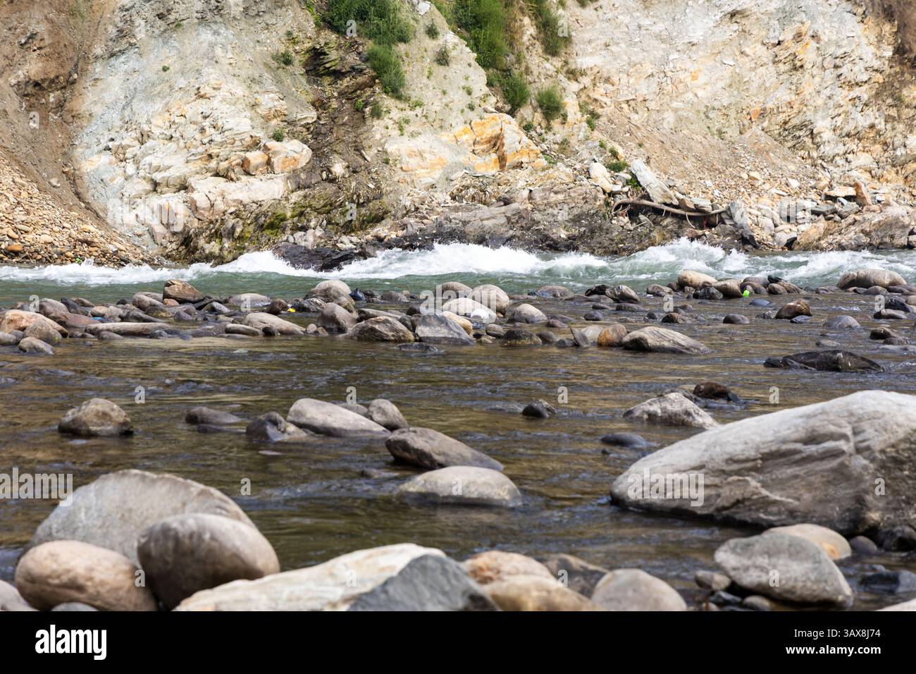 mountainous rocky river bed with small stream from flat angle Stock ...