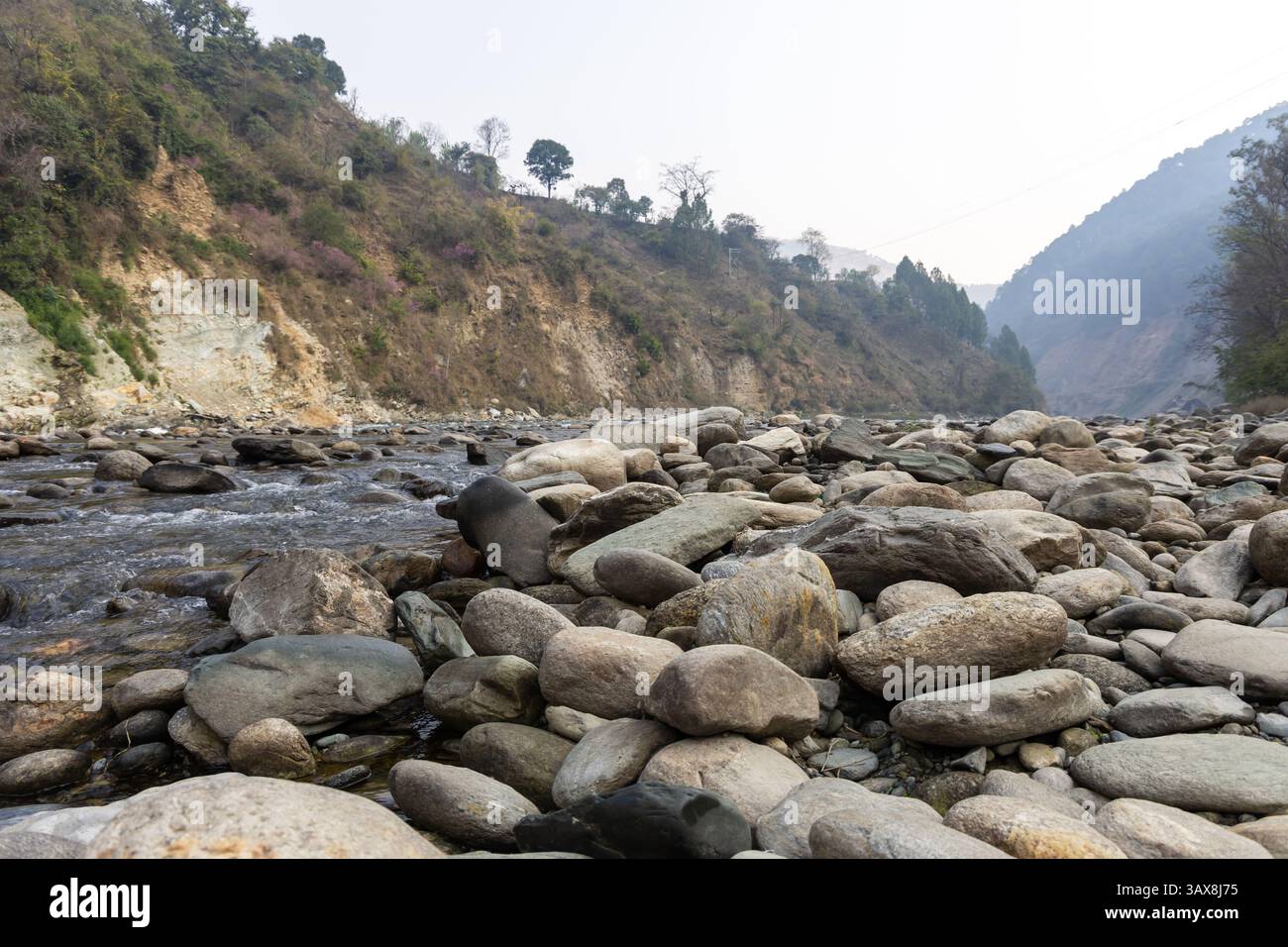 mountainous rocky river bed with small stream from flat angle Stock ...