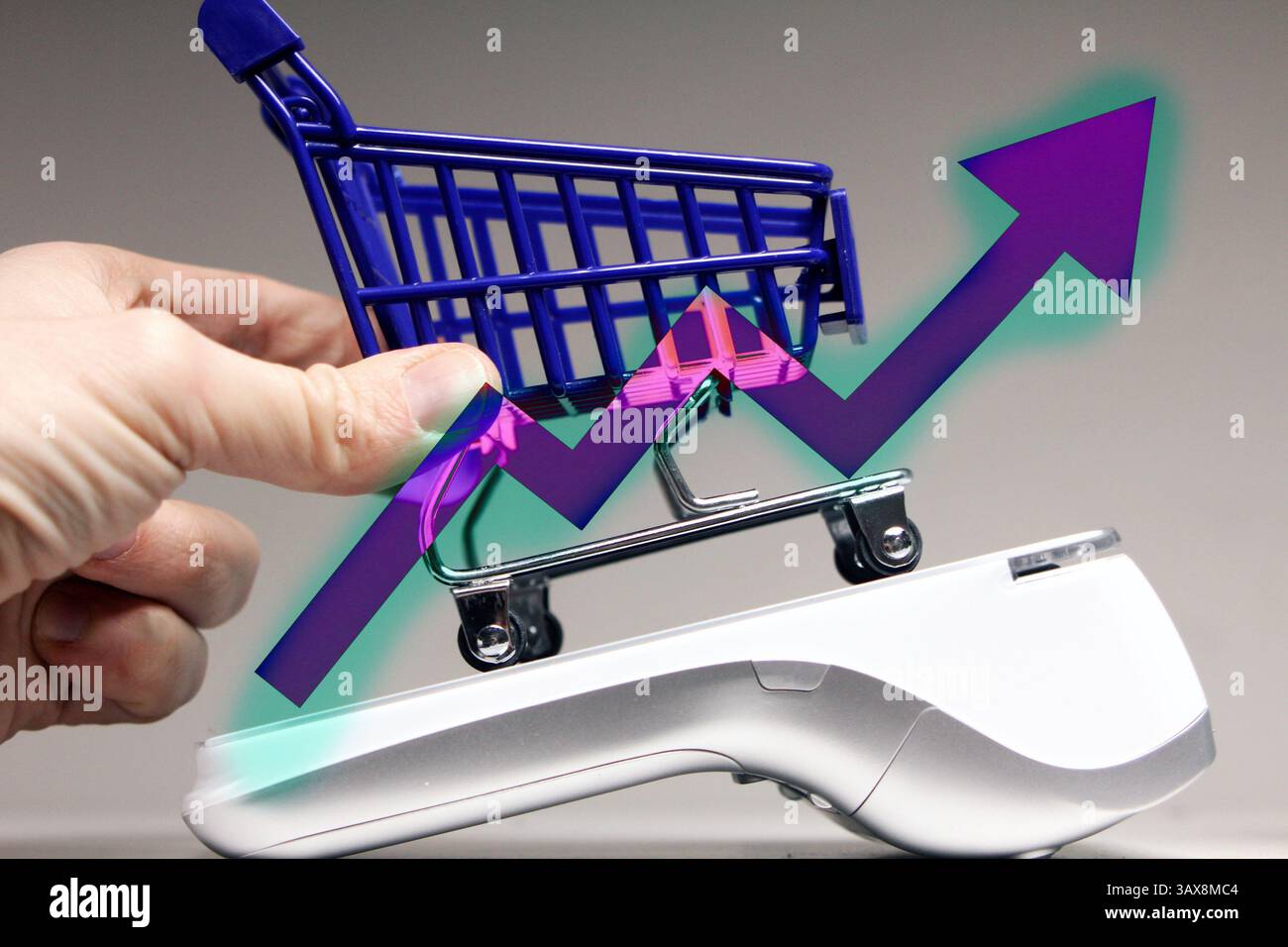 Miniature cart from supermarket. Inflation growth arrow. Consumer ...