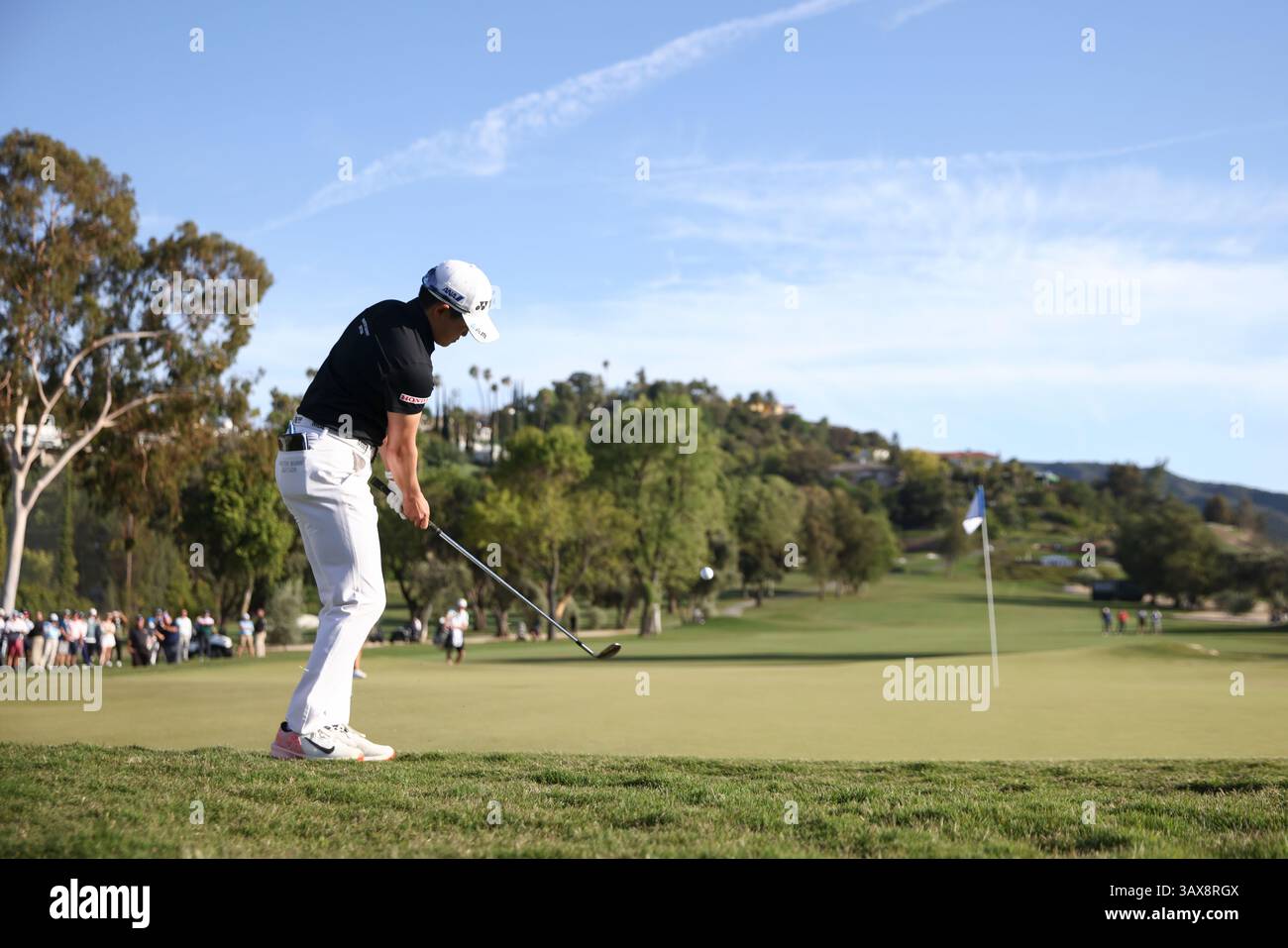 Akie Iwai chips the ball on the eighteenth green during the final round ...