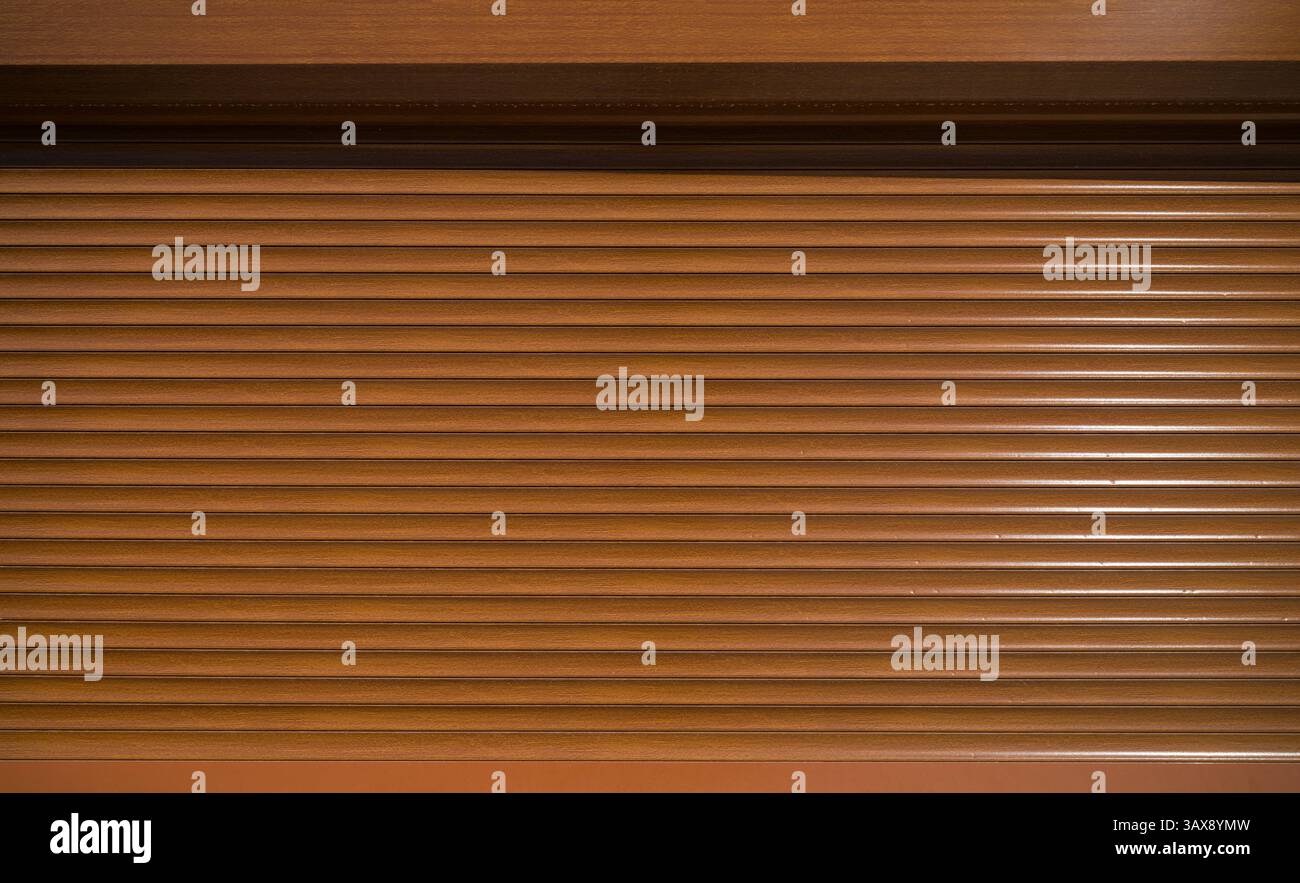 Shop or garage shutter. Retractable shutter Stock Photo - Alamy