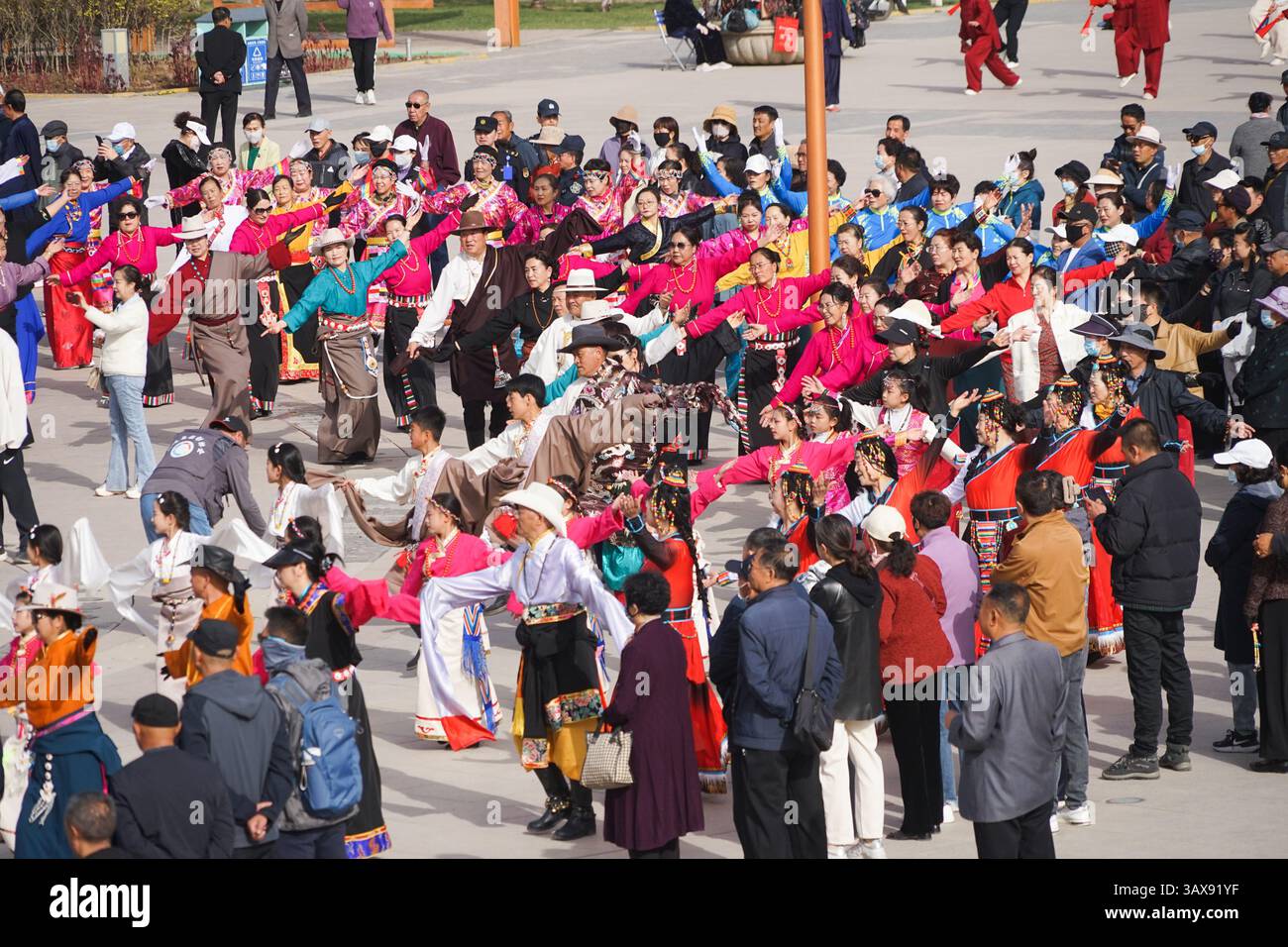 Xining,China.19th April 2025. People in Tibetan costumes perform ...