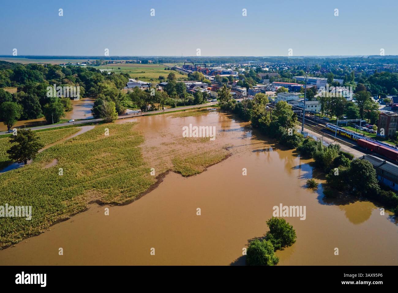 Aerial view of flooded streets, railway tracks and buildings in a ...