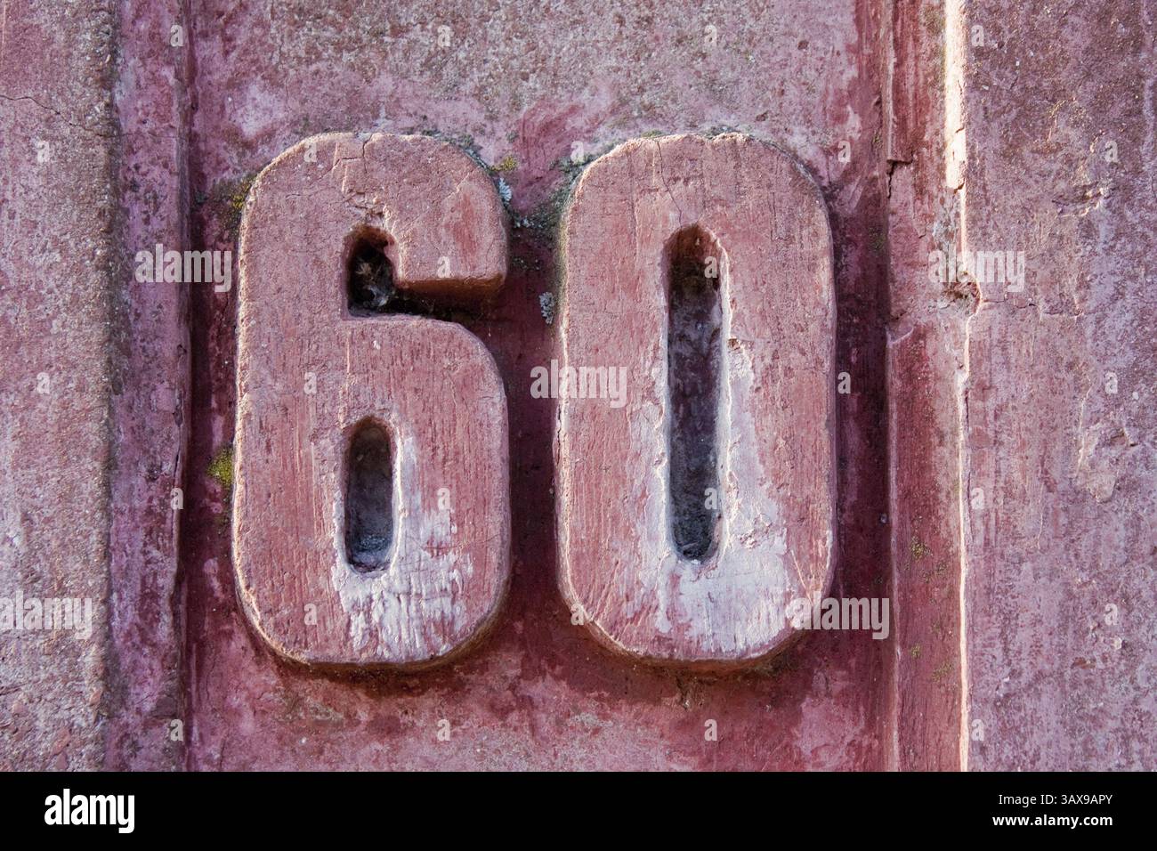 House number 60 on an old wall House number 60 on an old wall Stock ...