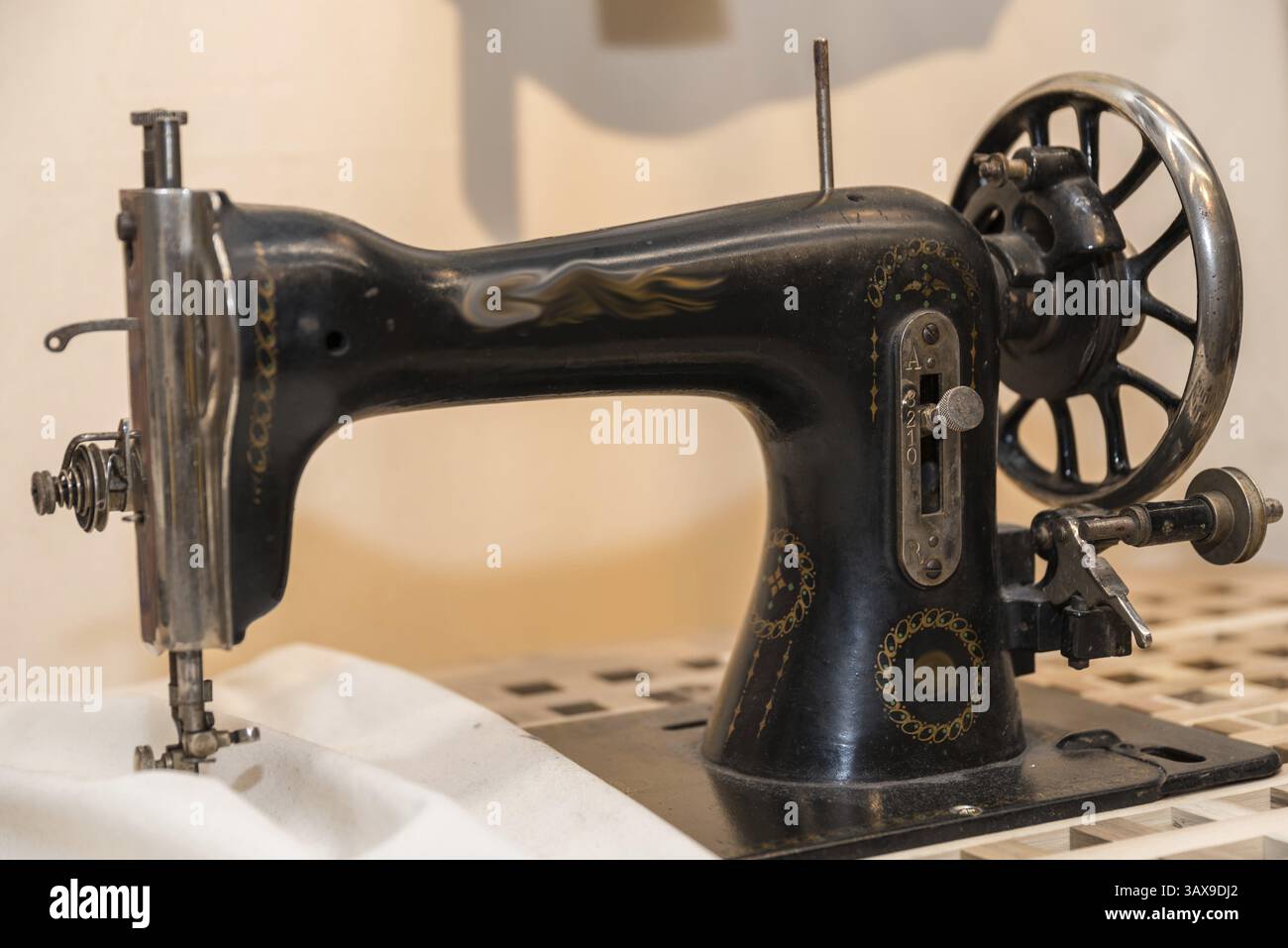 Old antique sewing machine with fabric - close-up tailoring Stock Photo ...