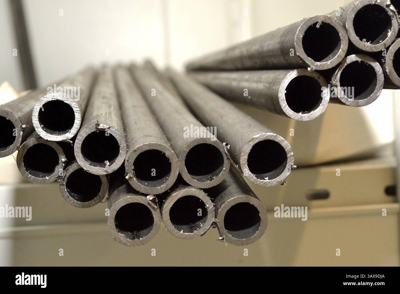 Stacked metal tubes from the front Stock Photo - Alamy
