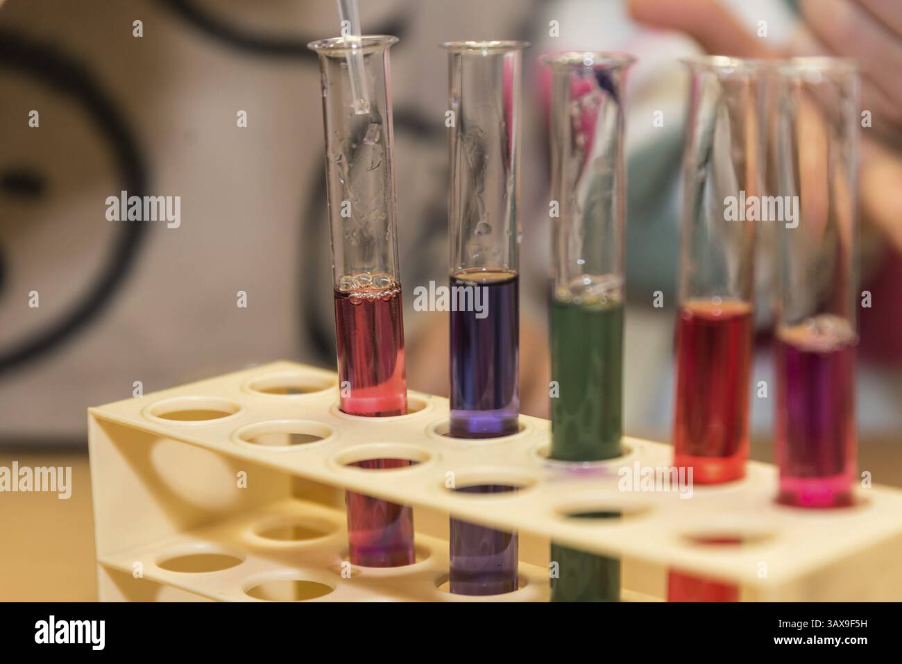 Chemical experiment at school with dye - acid and base reaction Stock ...
