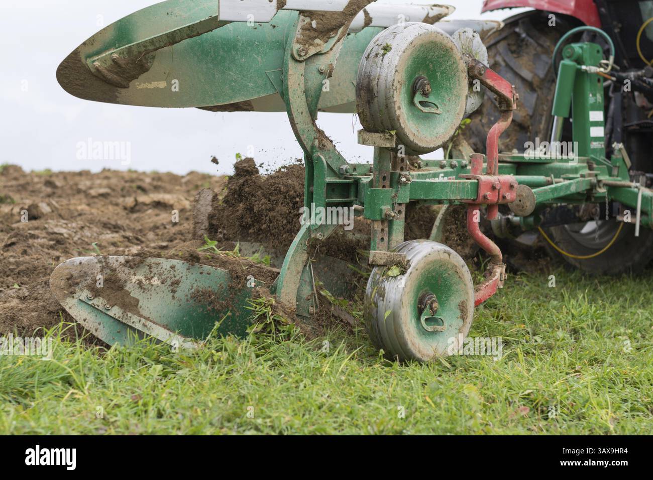 Bauer ploughs fresh soil Stock Photo - Alamy