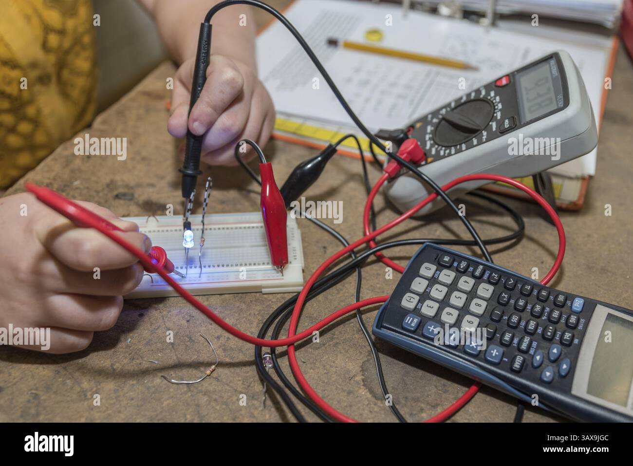 Electrical engineer working at his workplace with a voltage tester ...