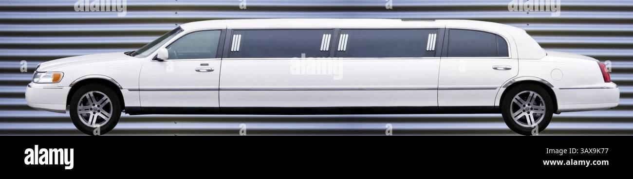 White stretch limousine in front of a garage White stretch limousine in ...