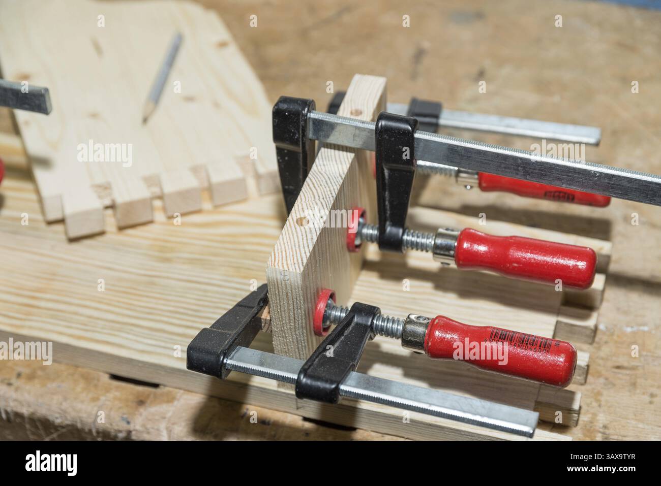 Screw clamps as a carpenter's tool in the workshop - Wood joints Stock ...