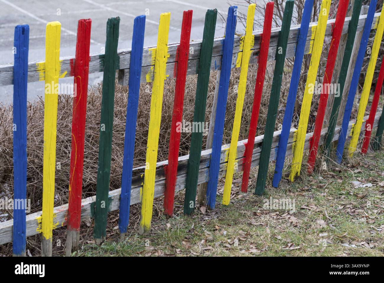 Close-up of a colourful wooden garden fence - old fence revitalised ...