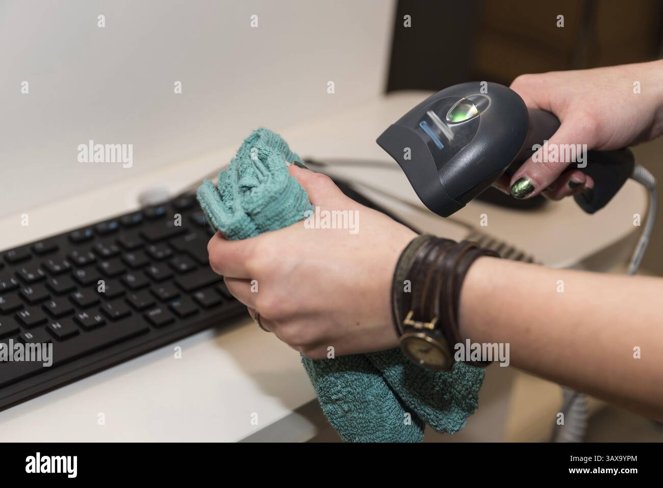 Saleswoman holding barcode scanner - close-up of barcode scanner Stock ...