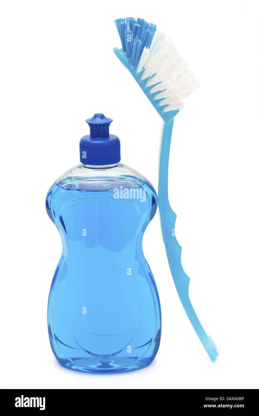 Dishwashing detergent with dishwashing brush over white background ...