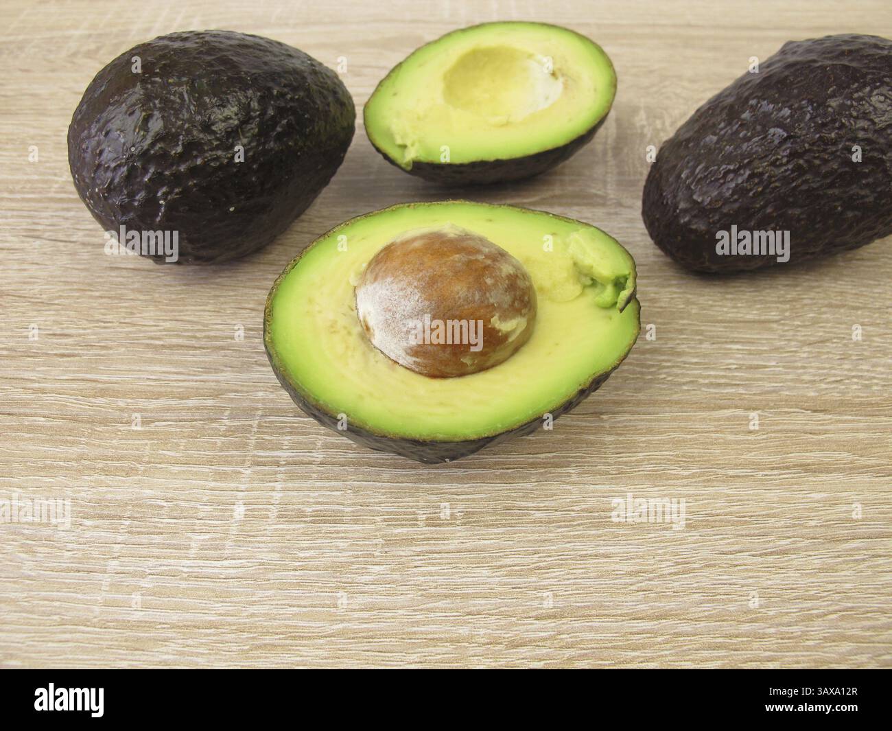 Fresh Hass avocado halves Stock Photo - Alamy