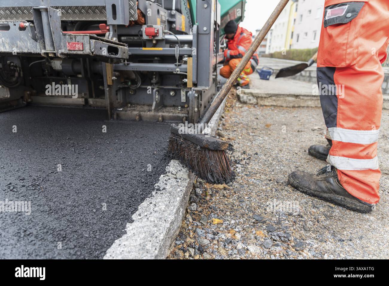 Workers asphalting pavement close hi-res stock photography and images ...