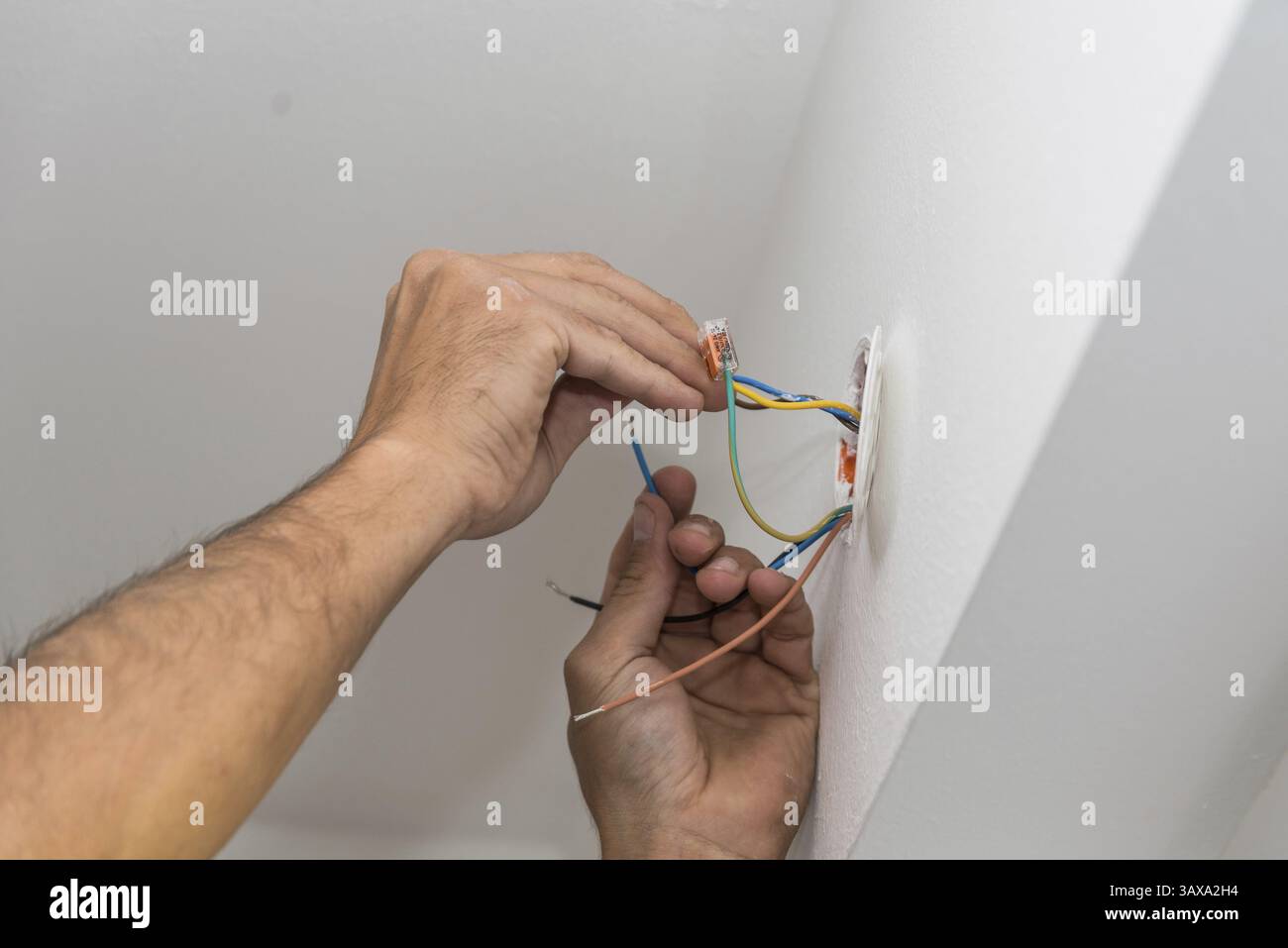Electrician wiring a socket in the house - electrician, electrical ...