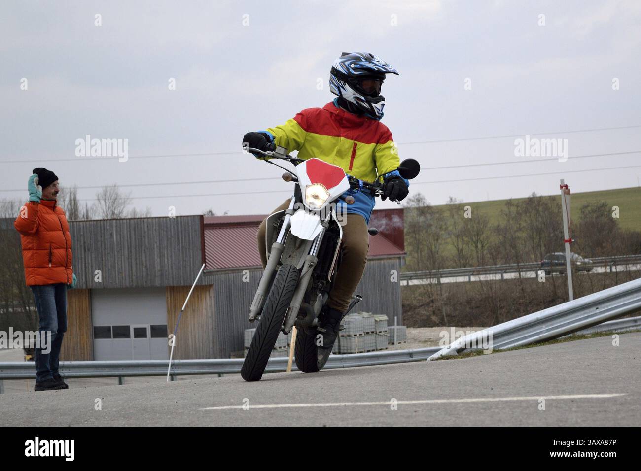 Driving instructor trains moped riders Stock Photo - Alamy