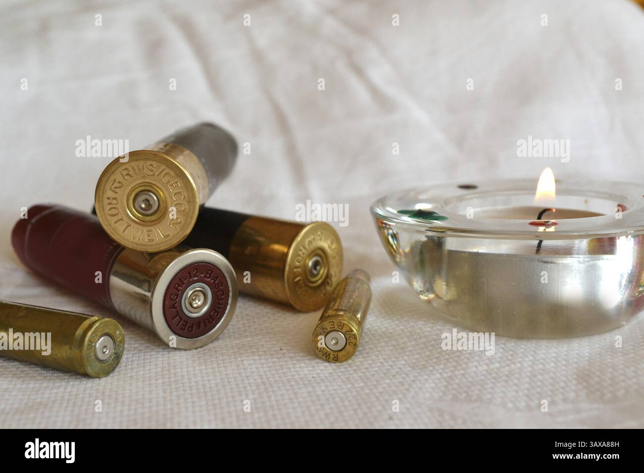 Cartridge cases and candle Stock Photo - Alamy