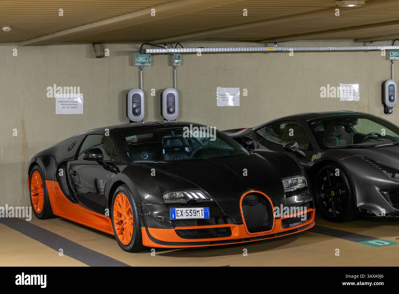 Monte Carlo, Monaco - View on a black carbon and orange Bugatti Veyron ...
