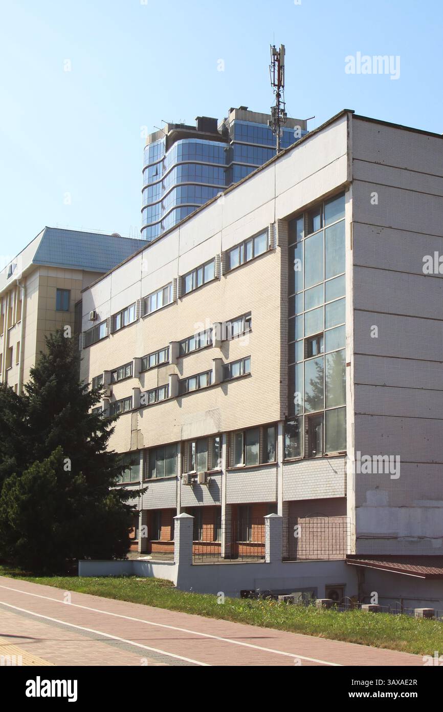 A grand and substantial building featuring an impressive tower situated ...