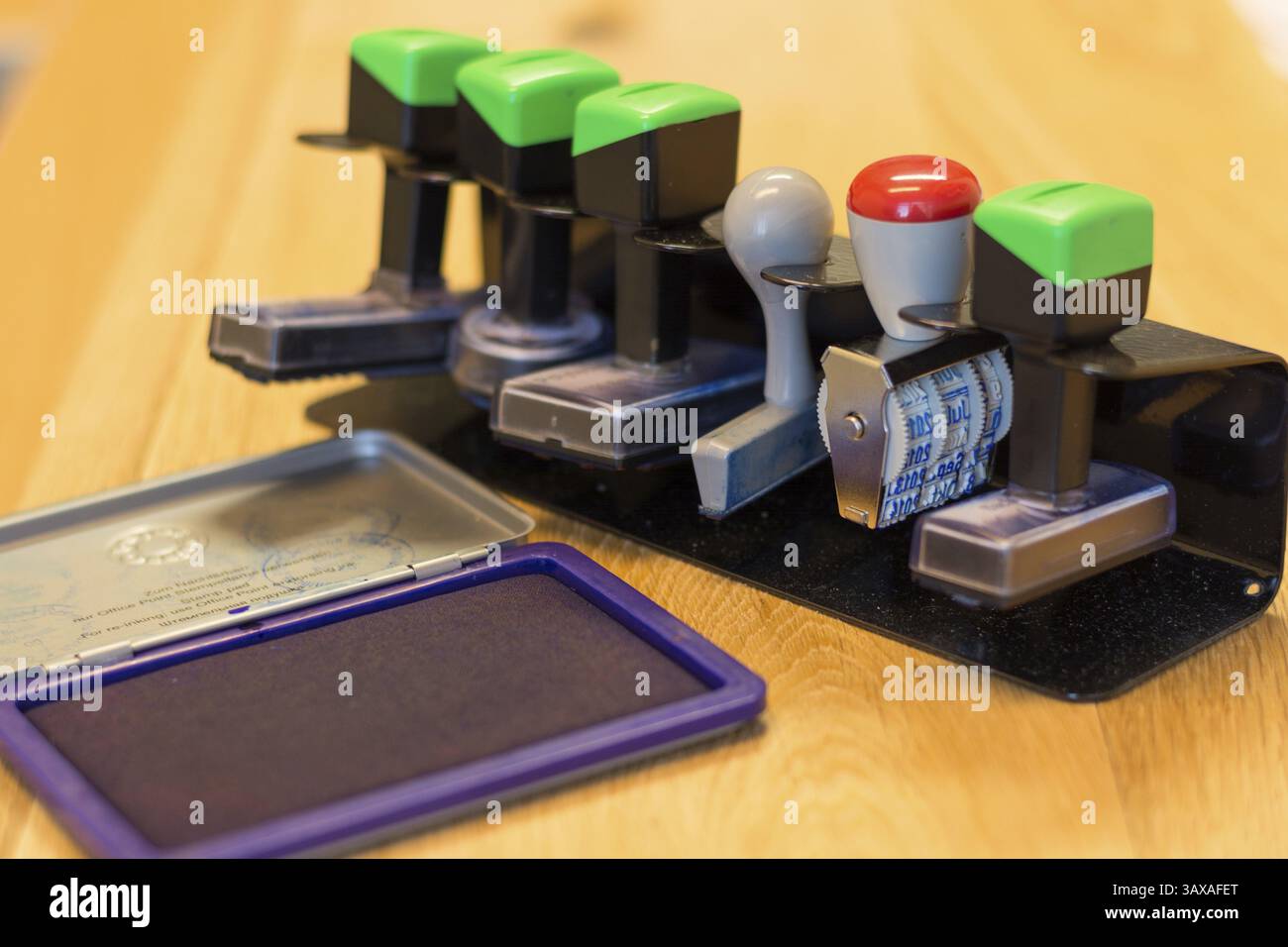 Different stamps in stamp holders, plus a stamp cushion Stock Photo - Alamy