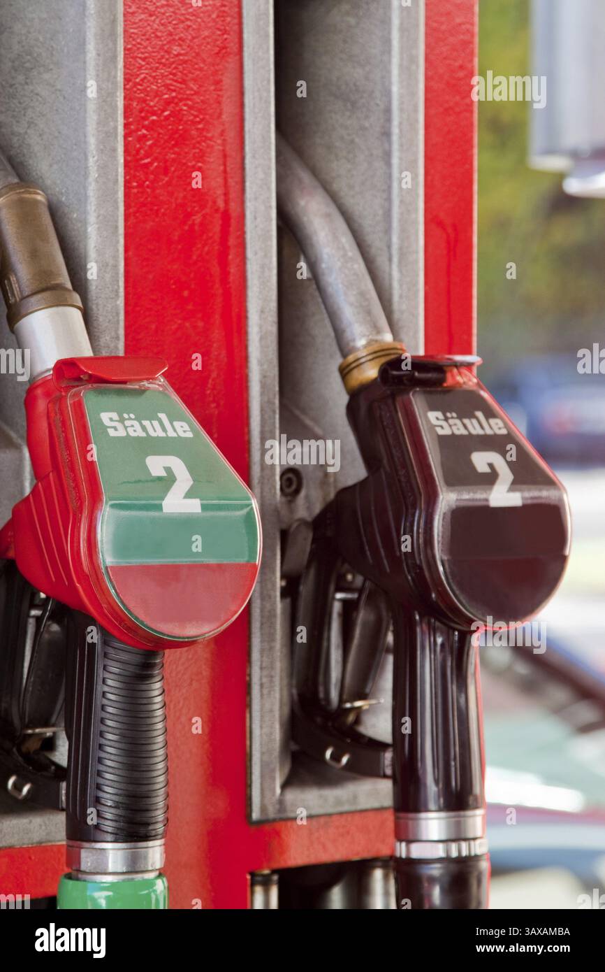 Dispensing nozzles at a petrol pump Stock Photo - Alamy