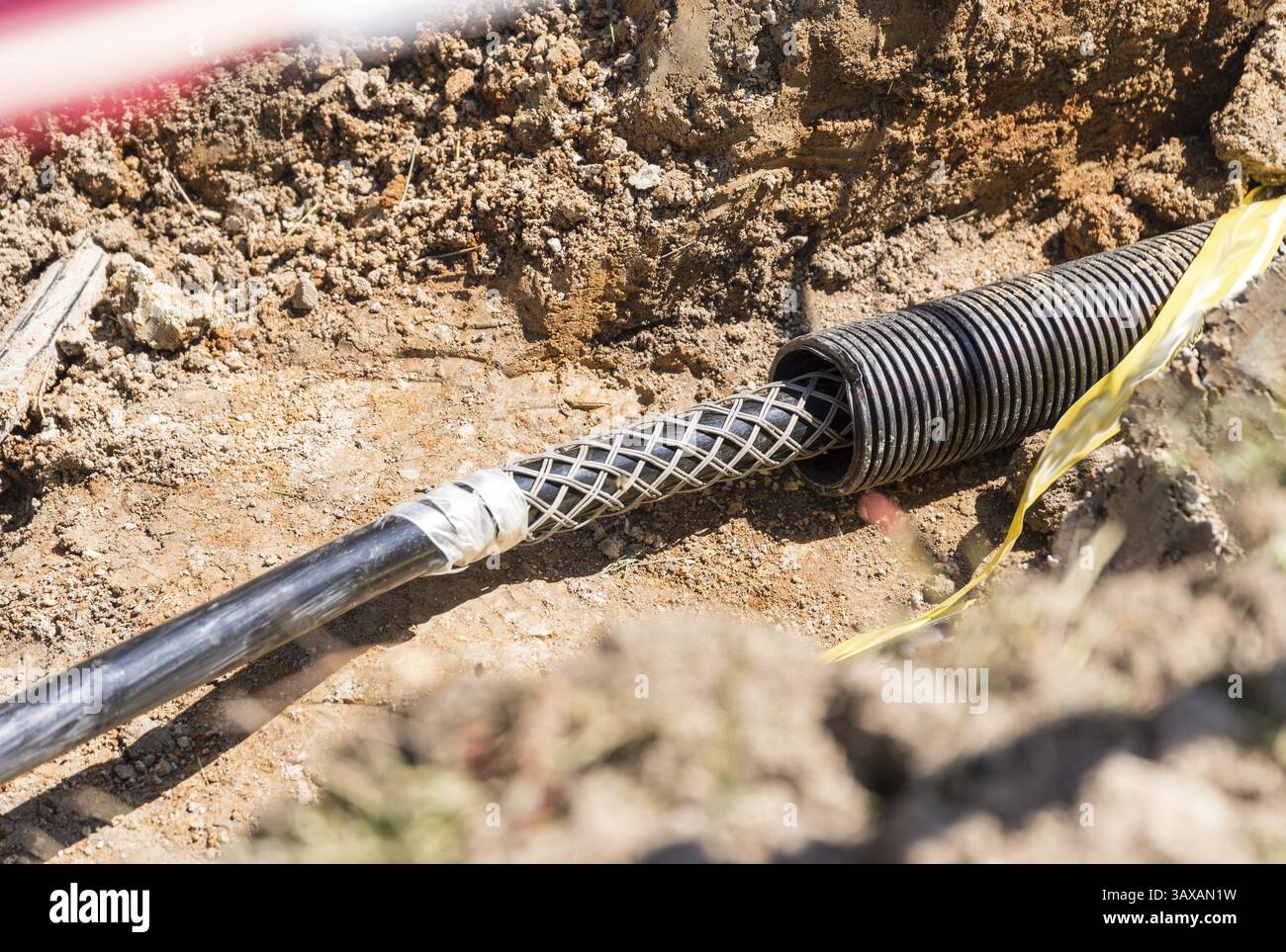 Laying an underground cable for power supply - high-voltage power cable ...