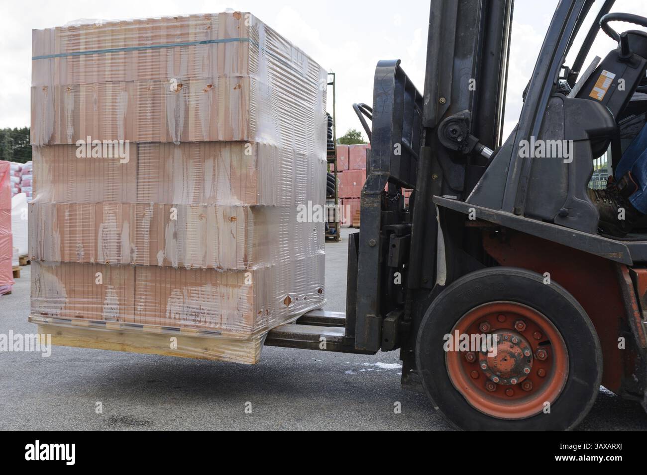Pallet of bricks being transported with a forklift truck Stock Photo ...